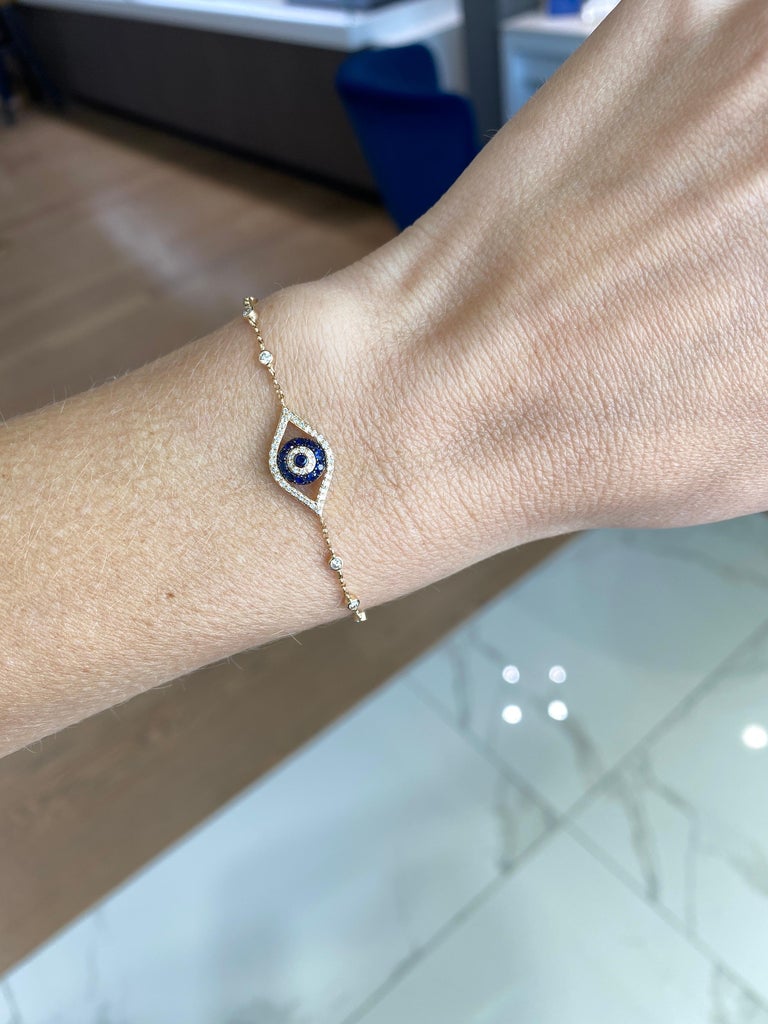 0.25ctq Diamond and 0.24ctw Sapphire Evil Eye 14 Karat Yellow Gold Bracelet For Sale at 1stDibs