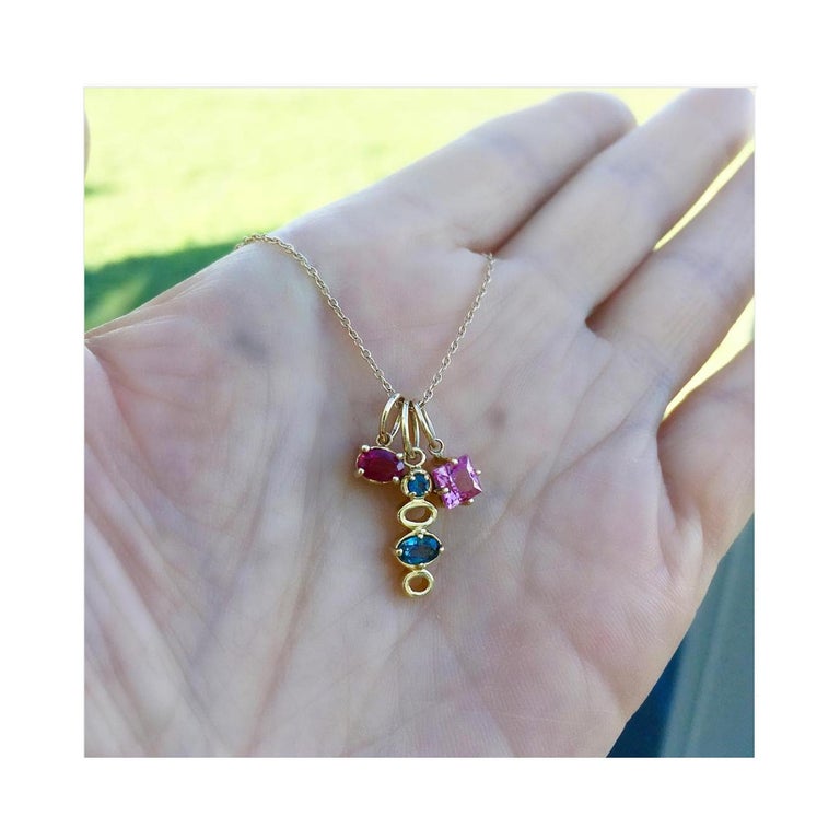 0.29 Carat Oval Ruby Stone Charm 14 Karat Gold For Sale at 1stDibs