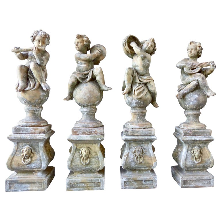 11940 Four Cast Composite Concrete Musical-Themed Cherubs at 1stDibs