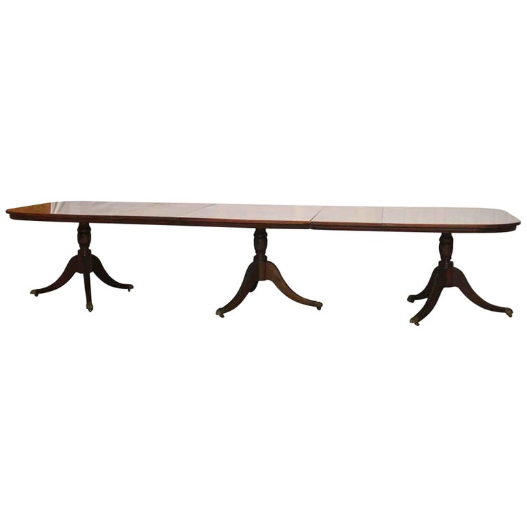 Duncan Phyfe Style Mahogany Dining Table with Extensions and Brass Feet ...