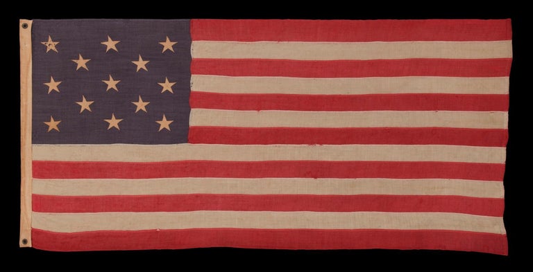 13 Star American Flag with Stars in a 3-2-3-2-3 Pattern on a Dusty Blue ...