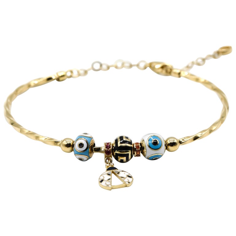 14 Karat Yellow Gold with Enamel Evil Eye Beads and Lady Bug Charm Bracelet For Sale at 1stDibs