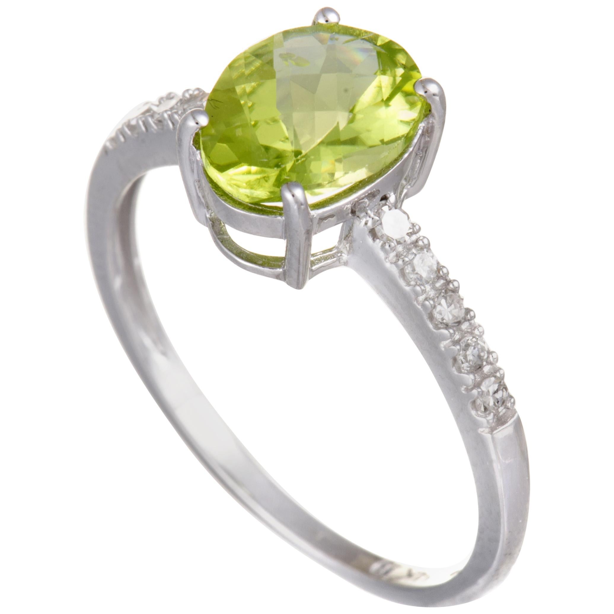 14 Karat White Gold Diamond and Oval Peridot Ring at 1stDibs
