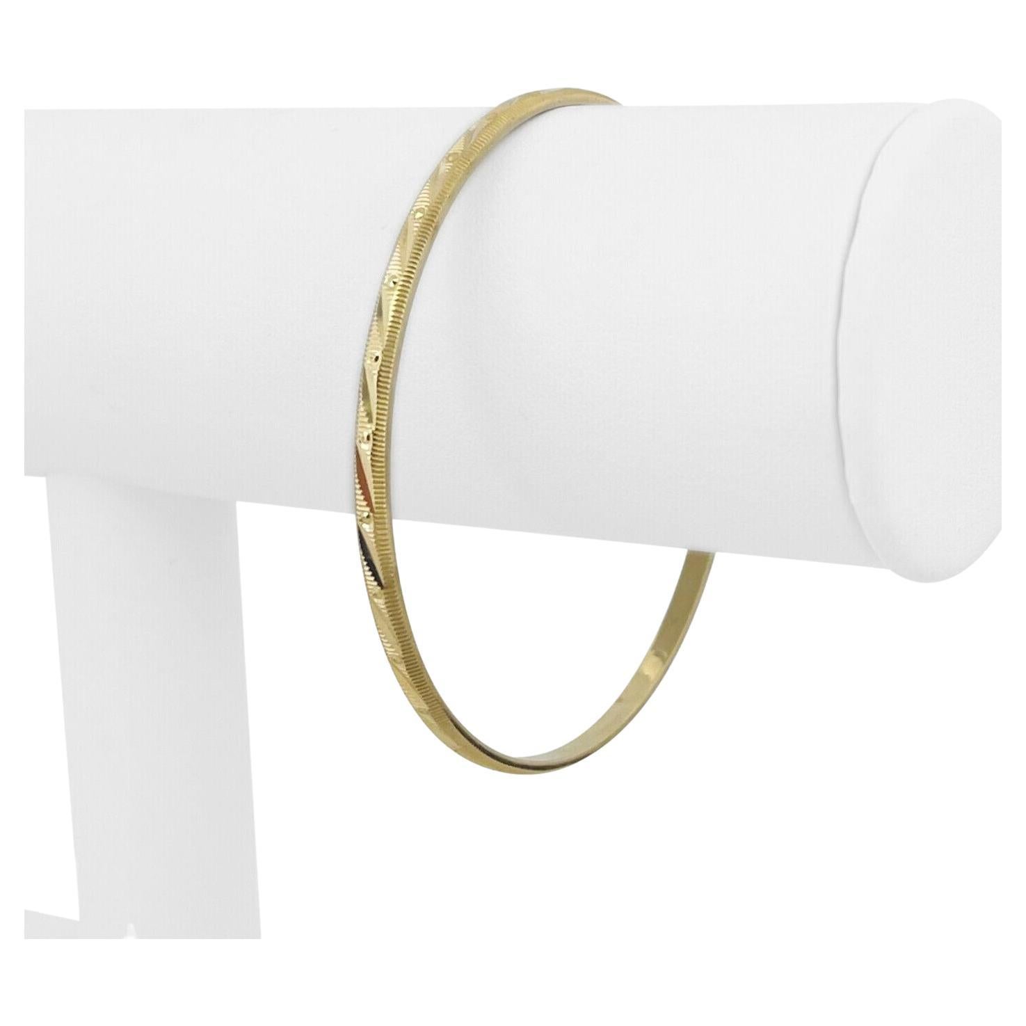 Ladies 14 Karat Yellow Gold Emerald and Diamond Bangle For Sale at 1stDibs