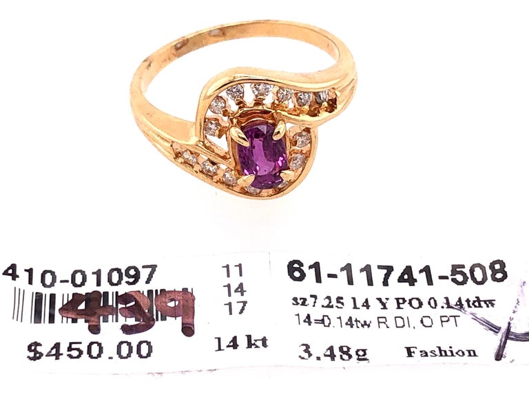 14 Karat Yellow Gold Purple Peridot Ring with Round Diamond Accents 0. ...