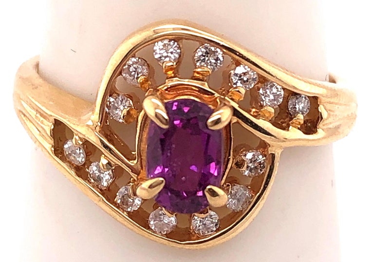 14 Karat Yellow Gold Purple Peridot Ring with Round Diamond Accents 0. ...