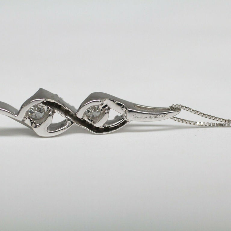 14 Karat White Gold Diamond Figure 8 Pendant For Sale at 1stDibs