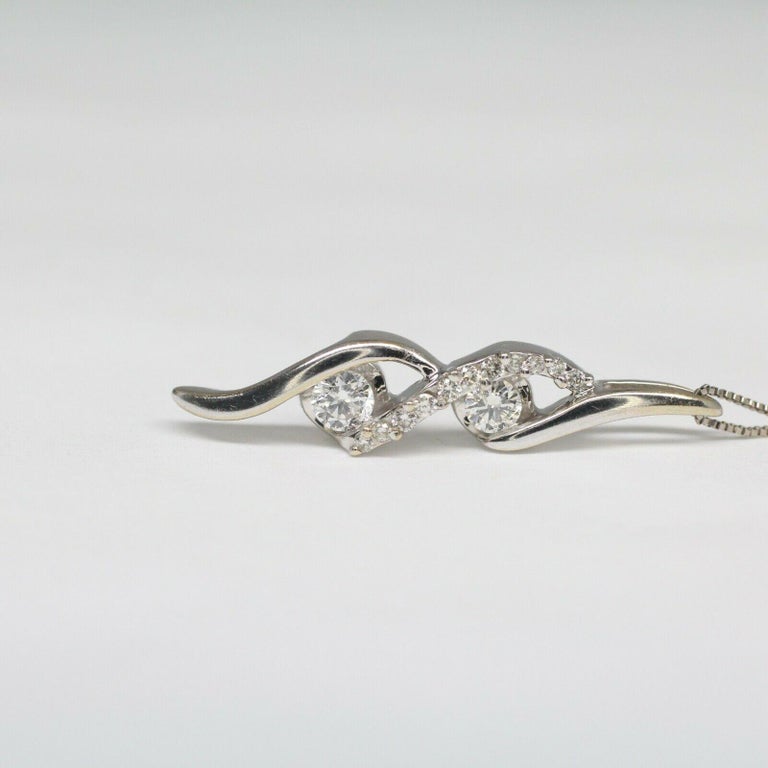 14 Karat White Gold Diamond Figure 8 Pendant For Sale at 1stDibs