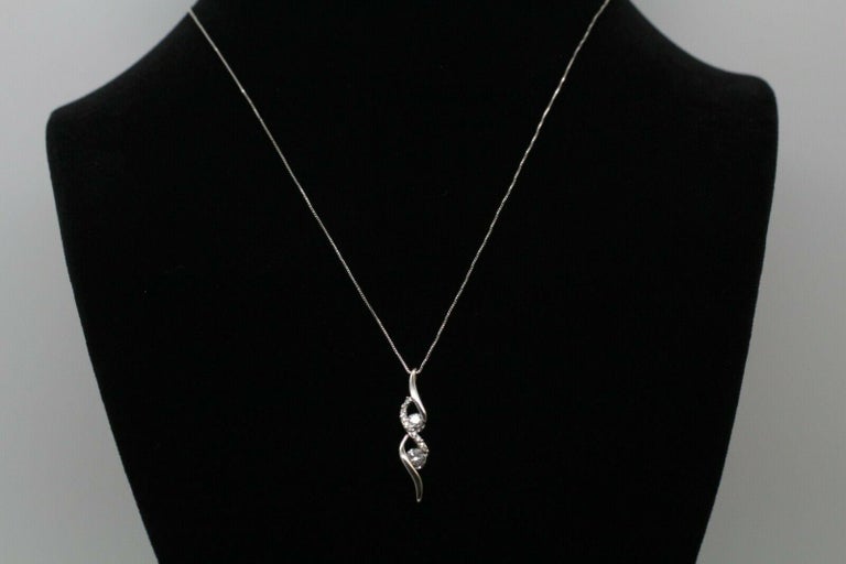 14 Karat White Gold Diamond Figure 8 Pendant For Sale at 1stDibs