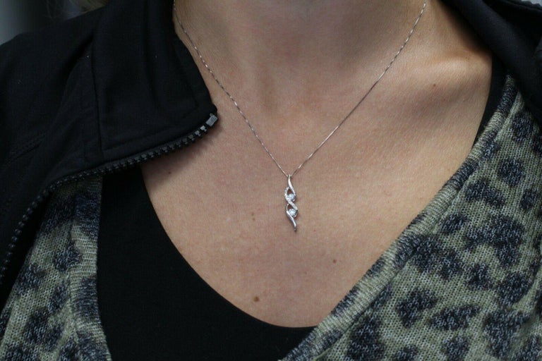 14 Karat White Gold Diamond Figure 8 Pendant For Sale at 1stDibs