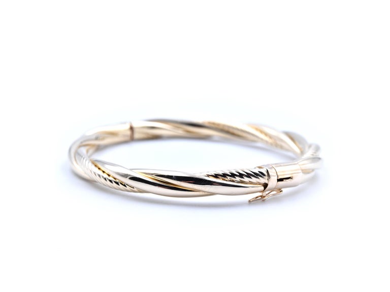 14 Karat Yellow Gold Twisted Bangle Bracelet at 1stDibs