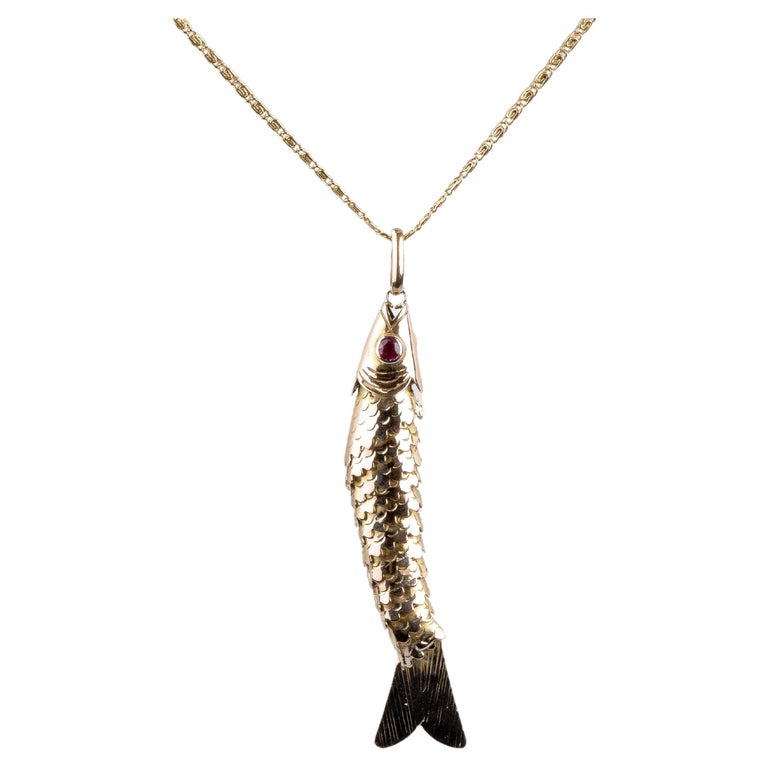 18 carat yellow gold chain designed with a rubies fish pendant at 1stDibs