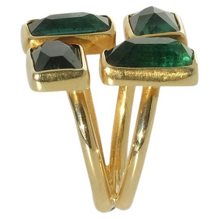 18 k gold ring with four mixed cut tourmalines. For Sale at 1stDibs