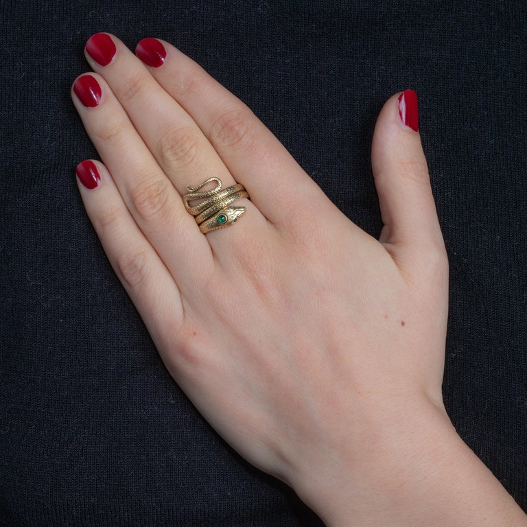 18 Karat Gold Coiled Snake Ring with Emerald and Sapphires at 1stDibs