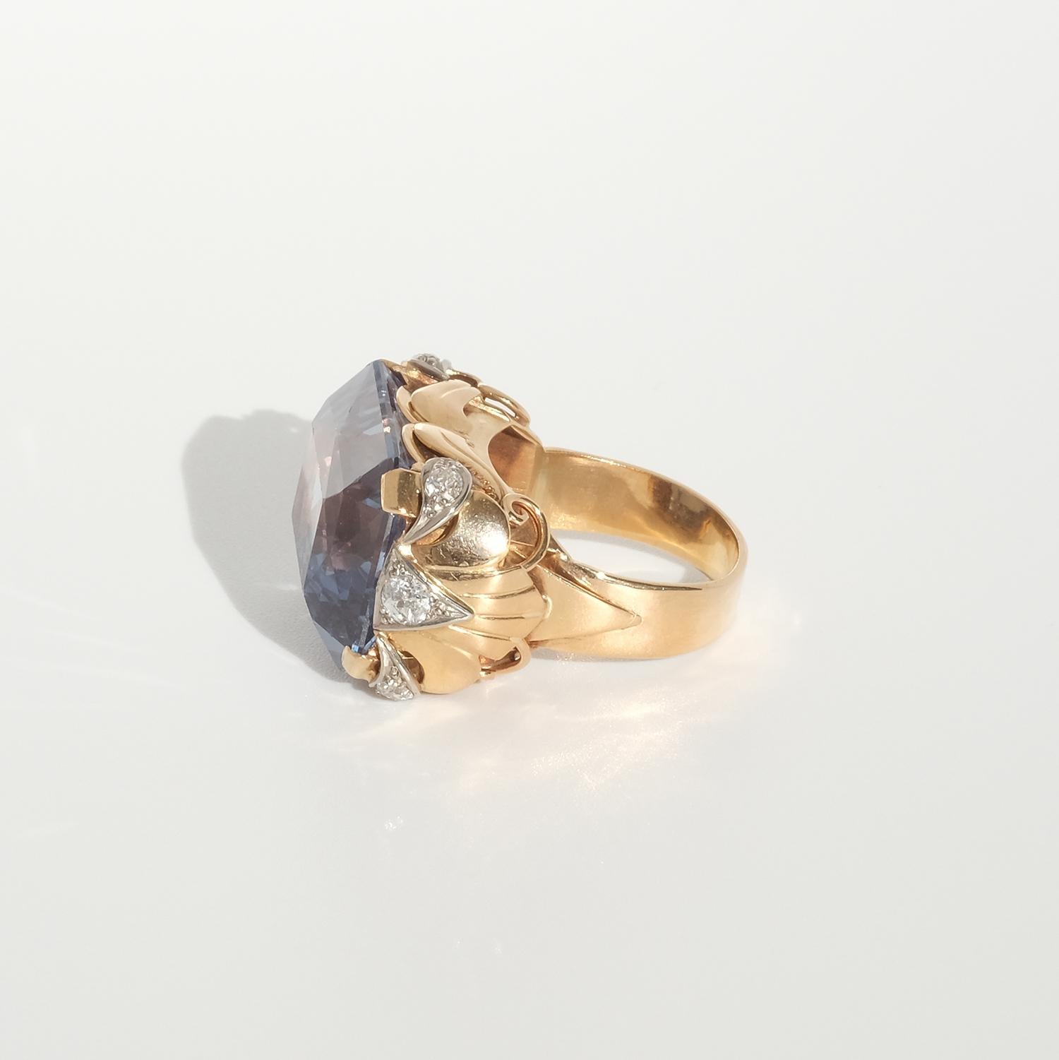 18 karat gold ring with a large synthetic spinel and diamonds. at ...