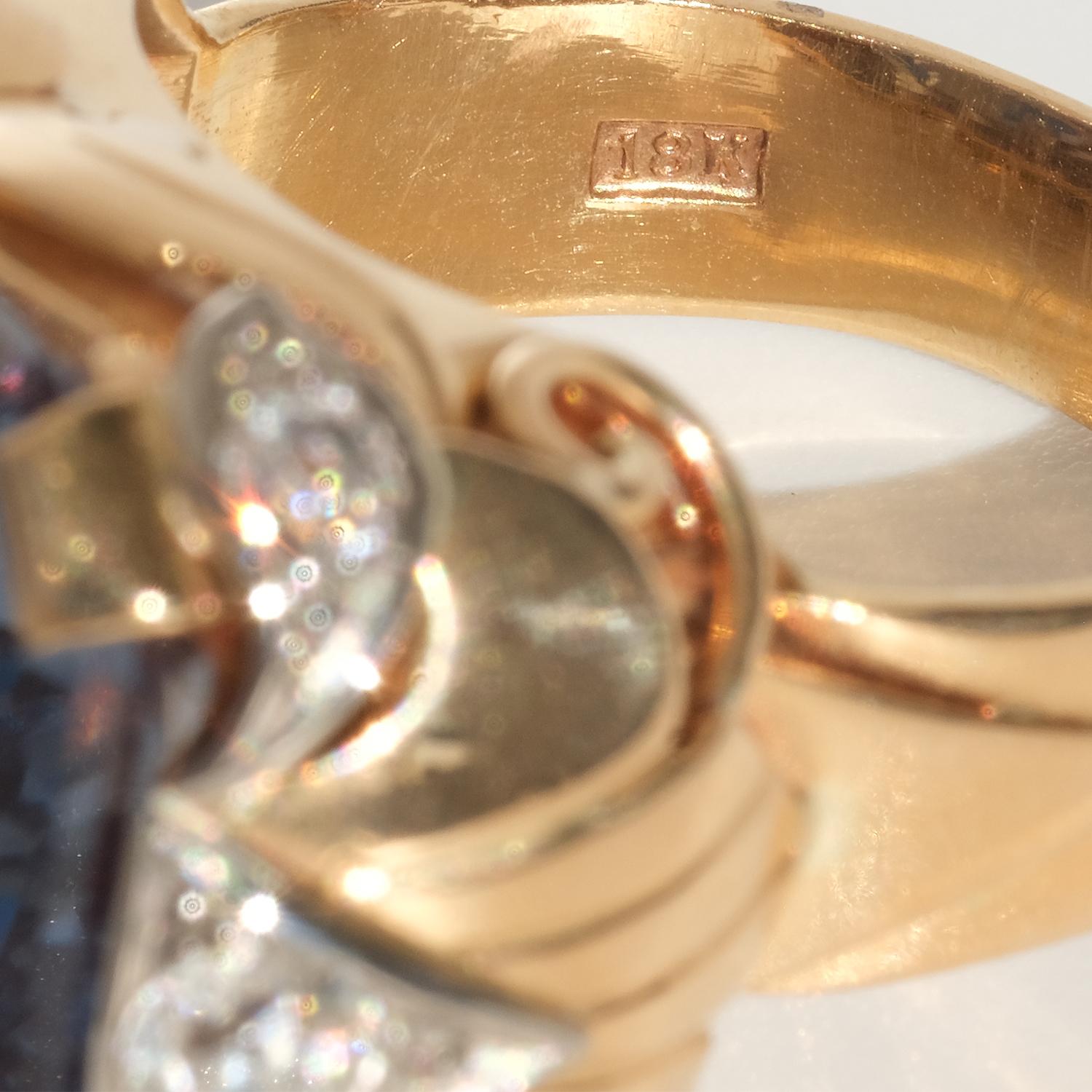 18 karat gold ring with a large synthetic spinel and diamonds. at ...