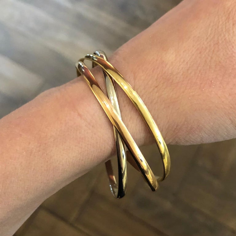 18 Karat Gold Trinity Bangle by Cartier at 1stDibs