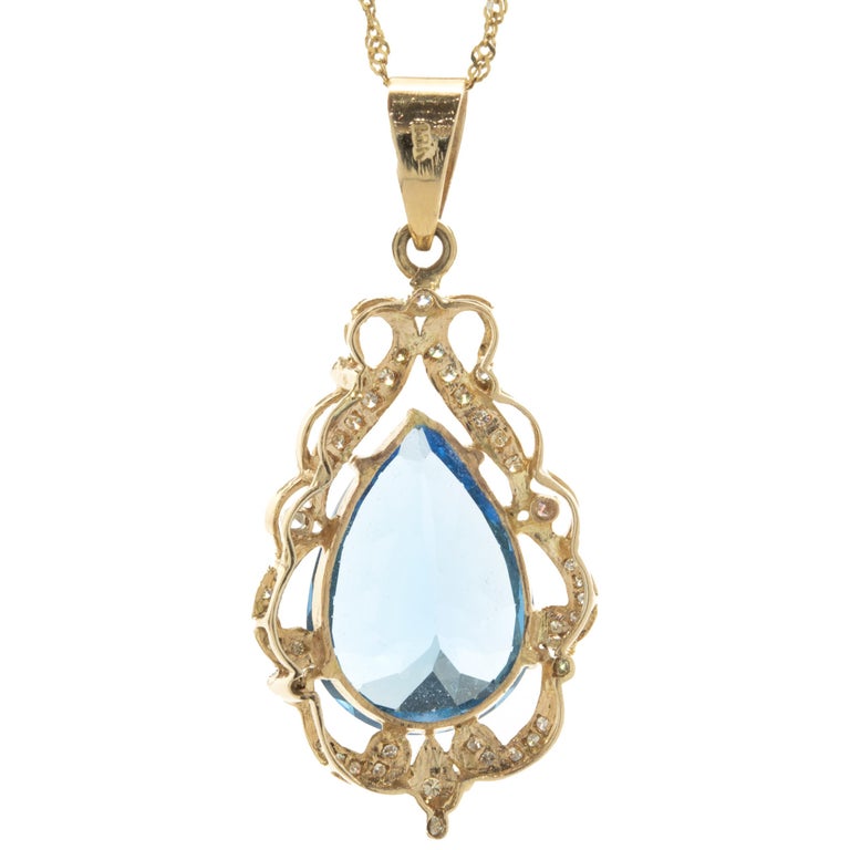 18 Karat Yellow Gold Pear Cut Blue Topaz and Diamond Freeform Pendant ...