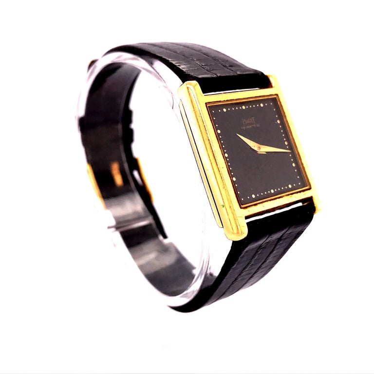 18 Karat Piaget Tank Watch Yellow Gold with Black Leather Band at 1stDibs