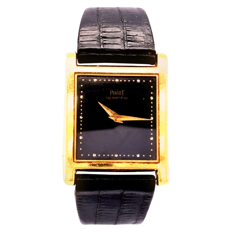 18 Karat Piaget Tank Watch Yellow Gold with Black Leather Band at 1stDibs