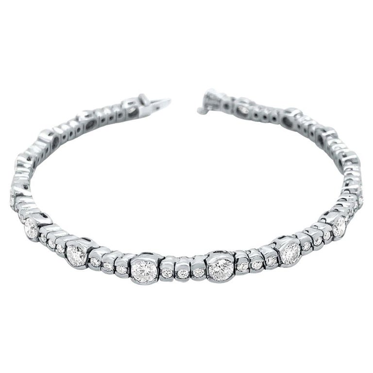 18K White Gold Women's Round Brilliant Diamond Half-Bezel Tennis Bracelet For Sale at 1stDibs