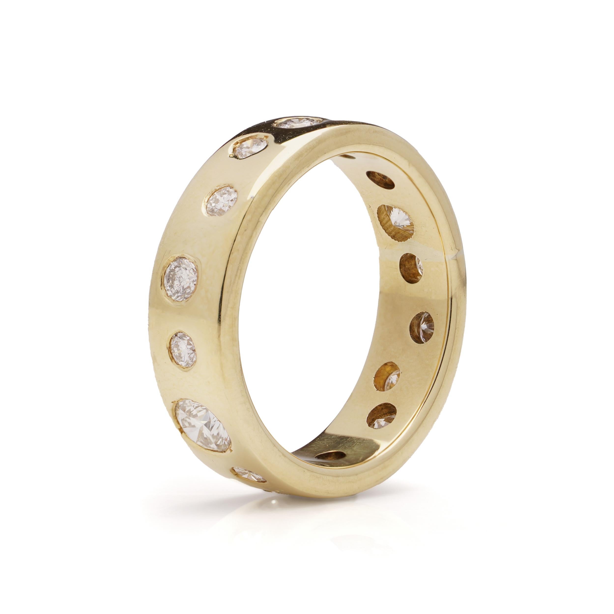 18kt. yellow gold band ring set with 1.30 cts. of round brilliant ...