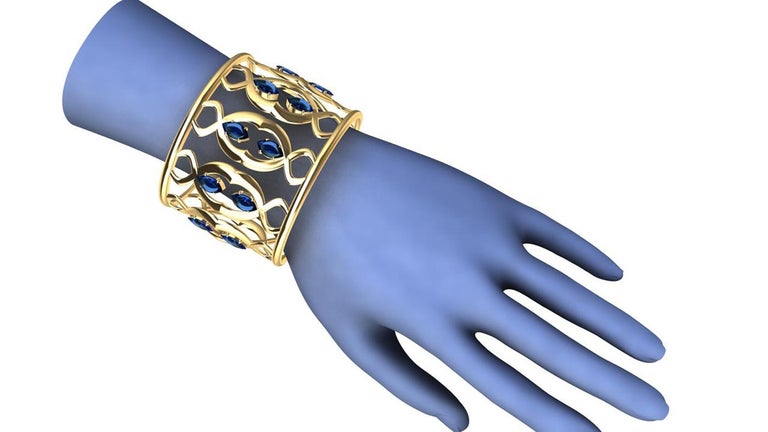 18 Karat Double Arabesque Cuff Bracelet with Sapphires For Sale at 1stDibs