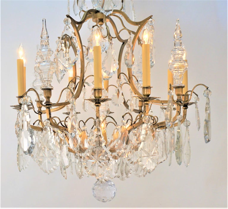 1930s Crystal and Gilt Metal Twelve Light Chandelier For Sale at 1stDibs
