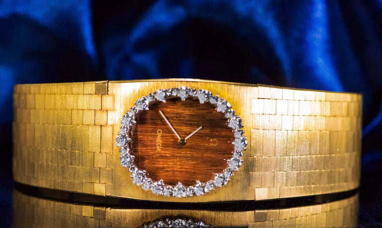 1970s Wide Omega Diamond Teak Wood Dial 18 Karat Yellow Gold Bangle ...