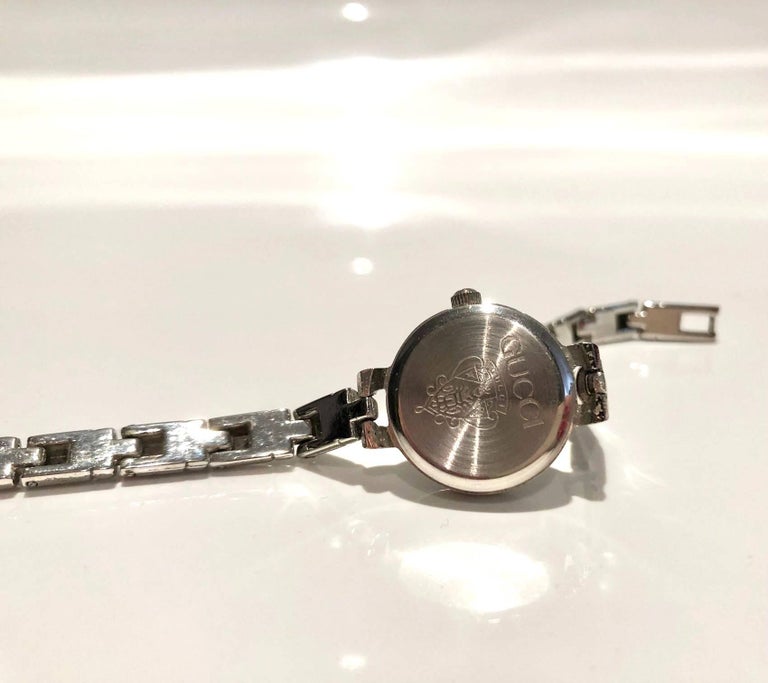 1980s Gucci Round Face Bamboo Steel wrist watch at 1stDibs