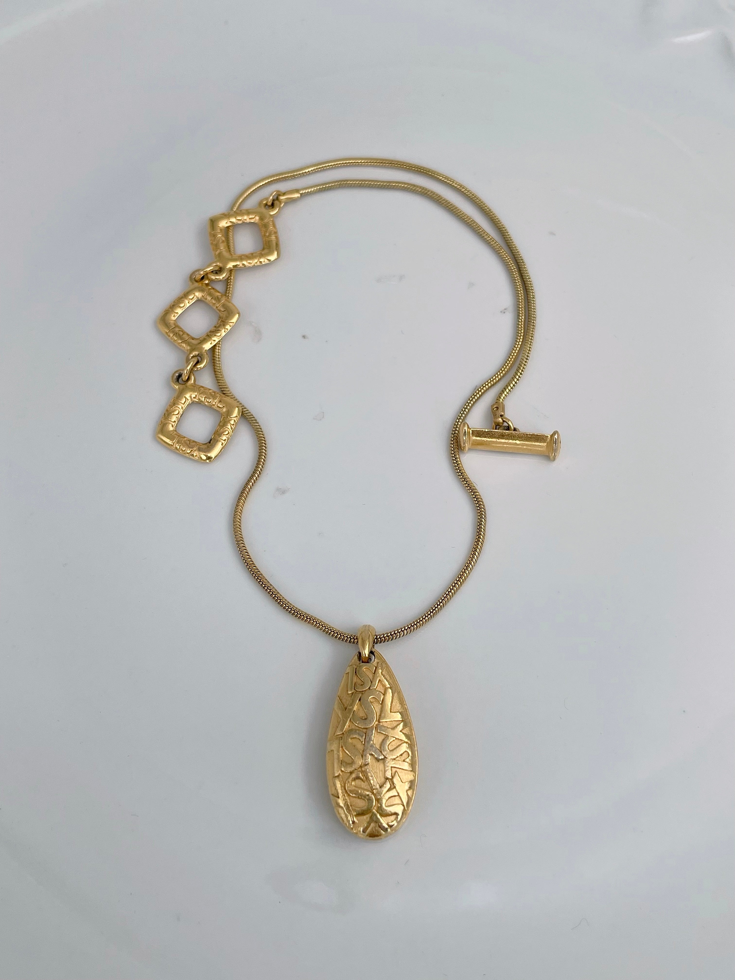 1980s Vintage Yves Saint Laurent YSL Gold Tone Monogram Drop Pendant ...
