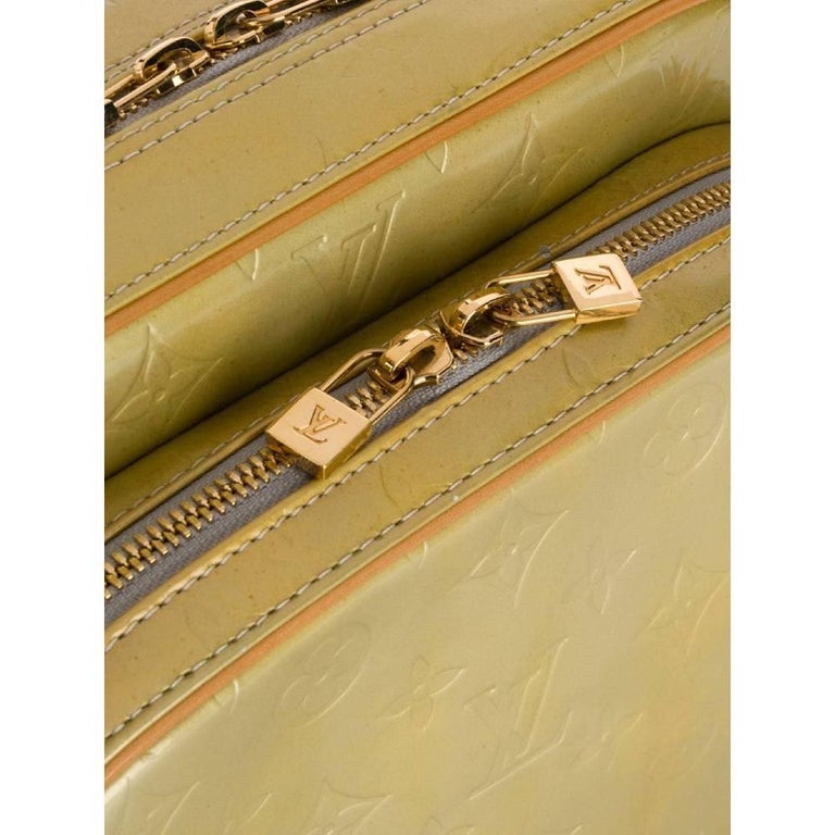 1990s Louis Vuitton Embossed Logo Backpack at 1stDibs