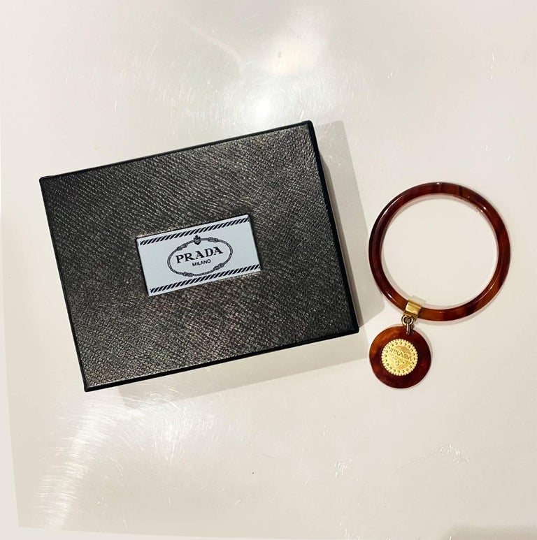 1990s Prada Resin Bangle with Hanging Medallion For Sale at 1stDibs