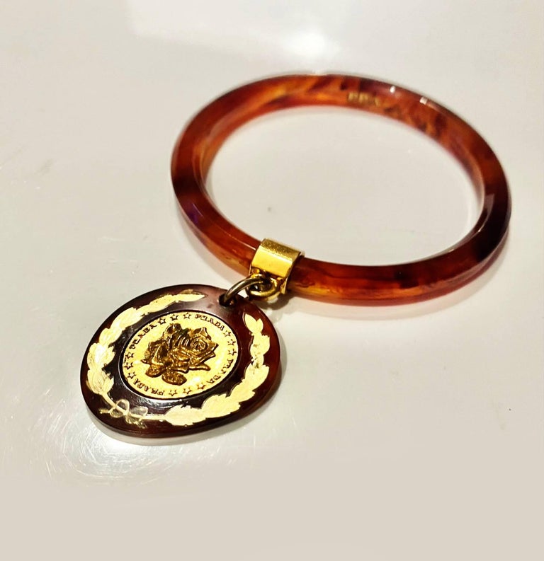 1990s Prada Resin Bangle with Hanging Medallion For Sale at 1stDibs