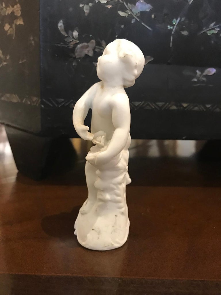19th-20th Century Porcelain Putti Figure For Sale at 1stDibs