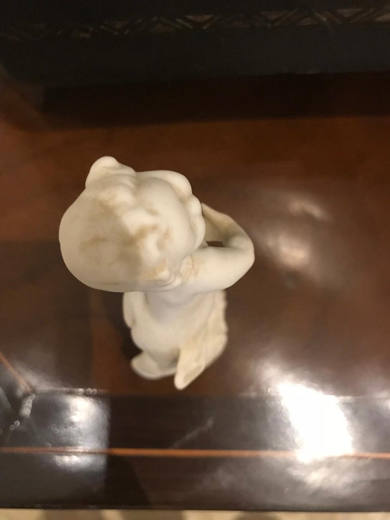 19th-20th Century Porcelain Putti Figure For Sale at 1stDibs
