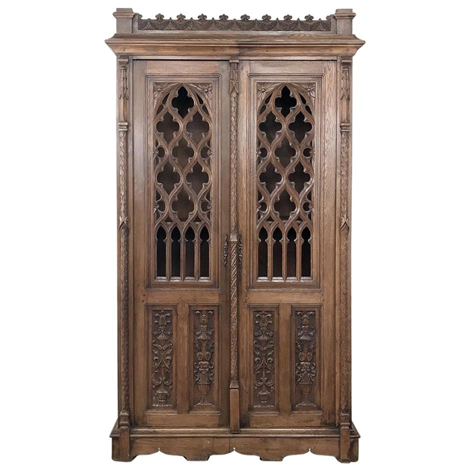 19th Century Carved Oak Gothic Double Sided Bookcase at 1stdibs