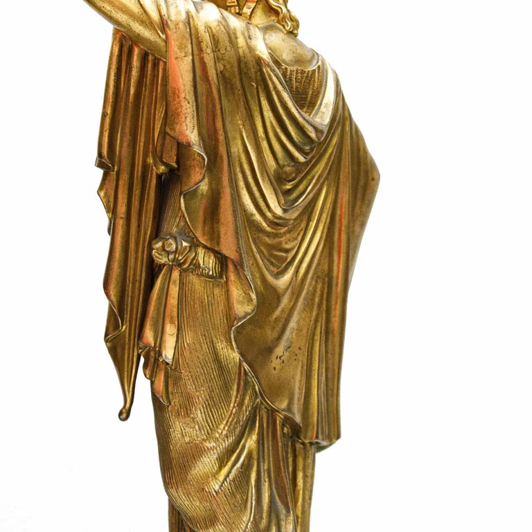 19th century, Pair of classic torch-holding figures in gilded bronze ...