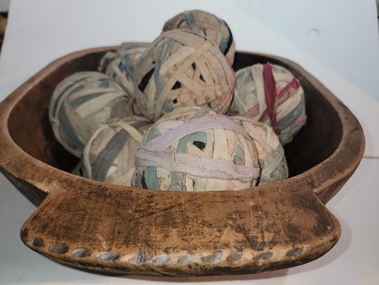 19th Century Hand Carved Dough Bowl with Rag Balls For Sale at 1stDibs