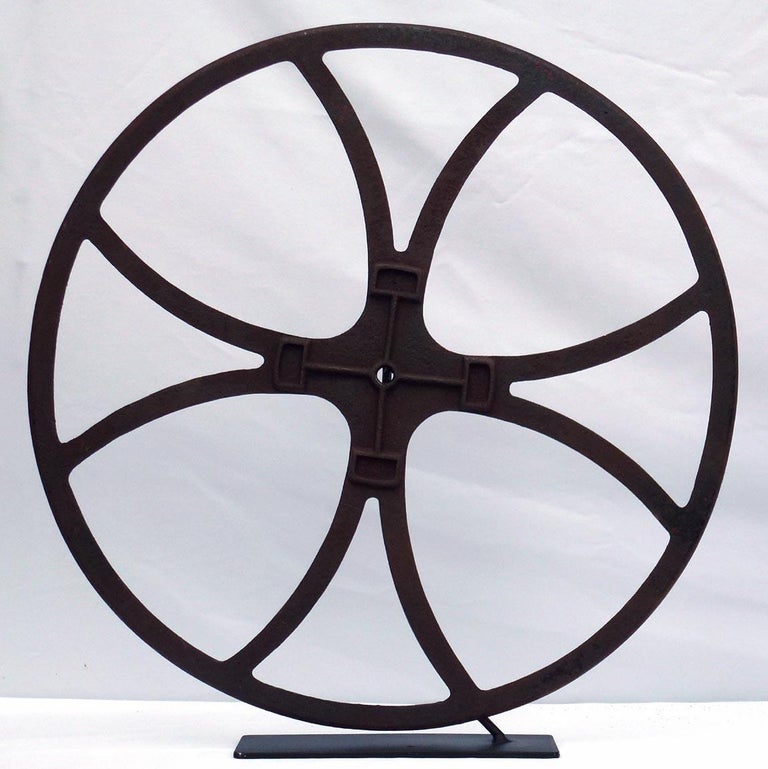 2 Different decorative cast iron wheels that were sides of fire truck ...