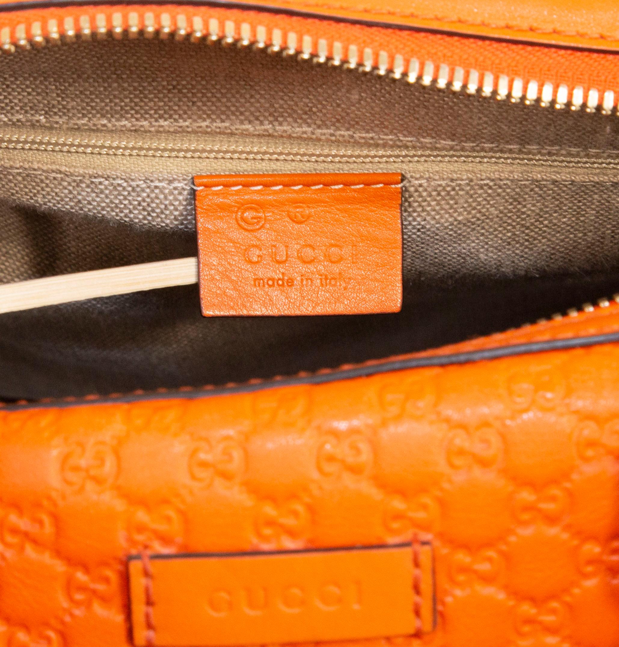 2000s Gucci Orange GG Embossed Leather Boston Bag For Sale at 1stDibs