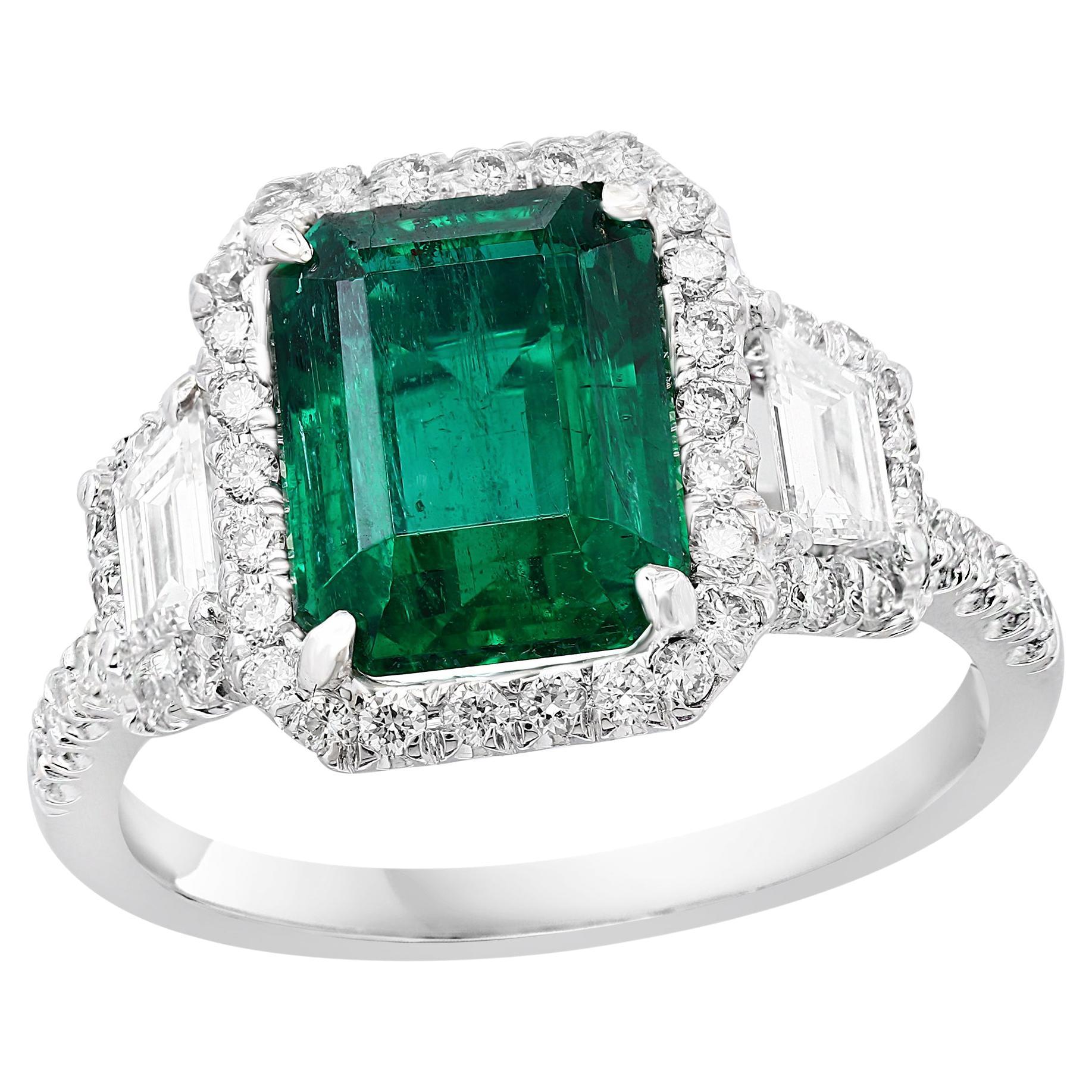 Rectangular 4.64 Carats Emerald Cut Three Stone Platinum Ring at 1stDibs