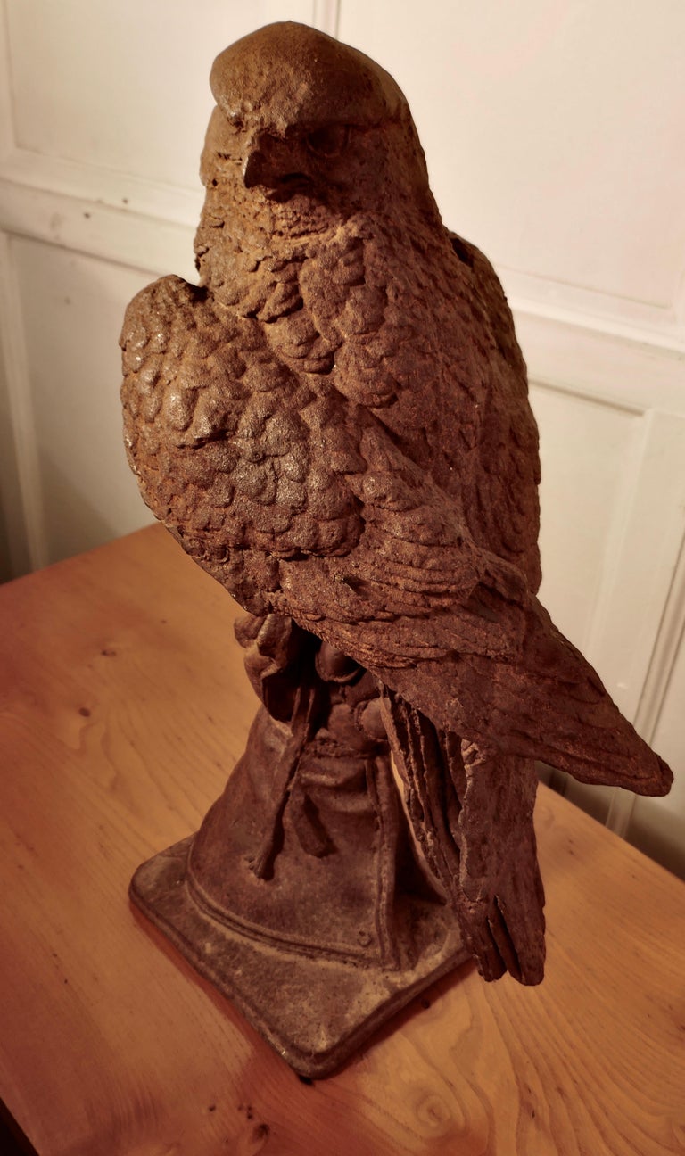Weathered Cast Iron Statue of a Falcon on a Gloved Hand For Sale at 1stDibs