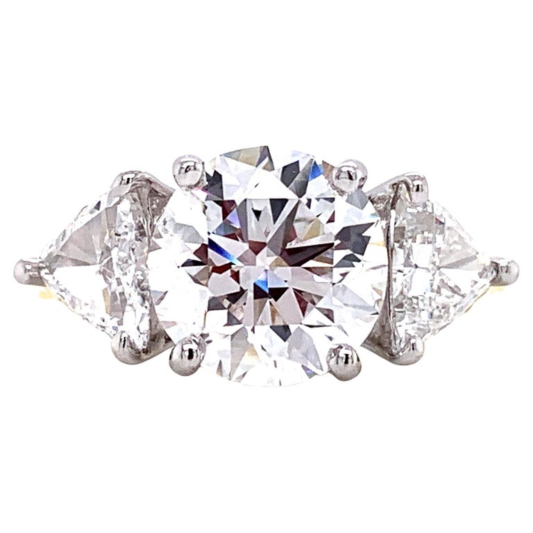 3.70ct Round Brilliant Cut Center with 1.60ct t.w. 2 Trillion Cut Side ...