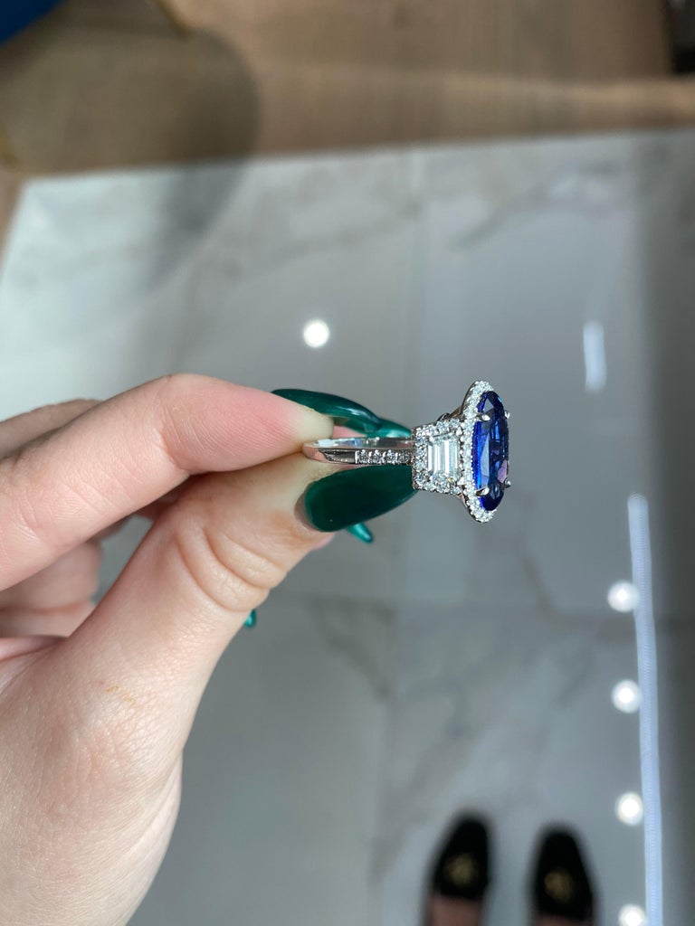 5.04ct Oval Sapphire with 0.68ctw Step Cut Trapezoid and 0.50ct Diamond ...