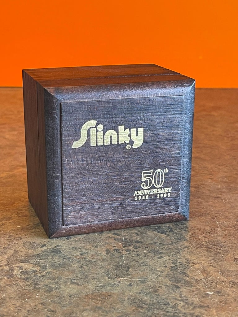 50th Anniversary Gold-Plated Slinky Toy in Wood Box at 1stDibs