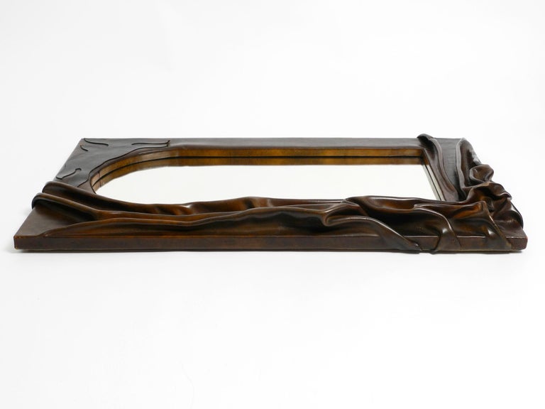 70s large wooden wall mirror with an elaborate and thick flowing ...