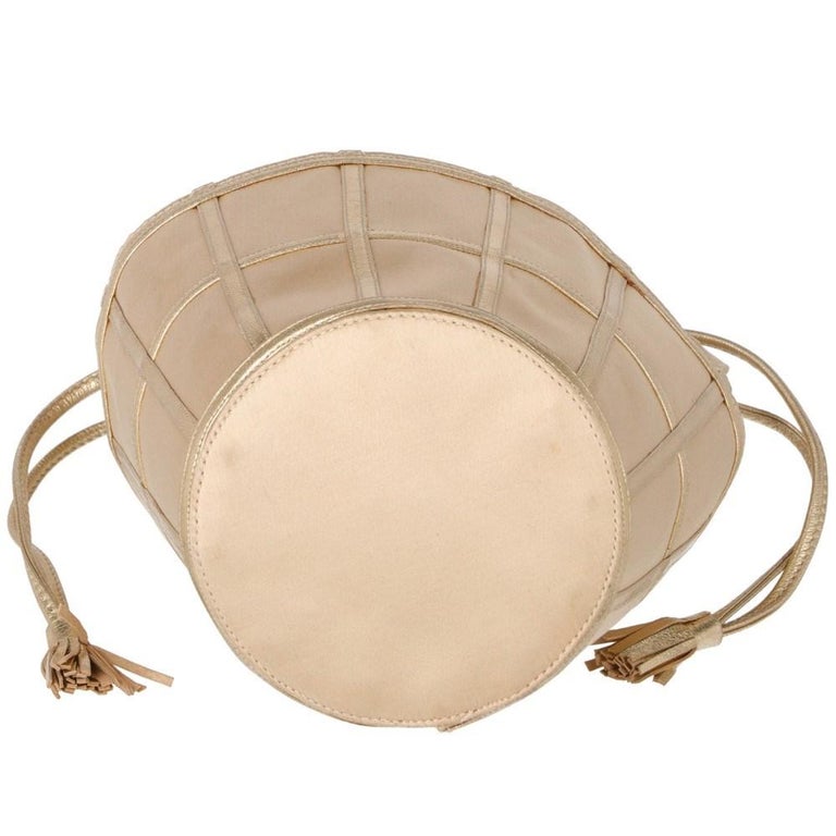 70s René Caovilla Vintage gold-tone leather bucket bag with silk satin ...