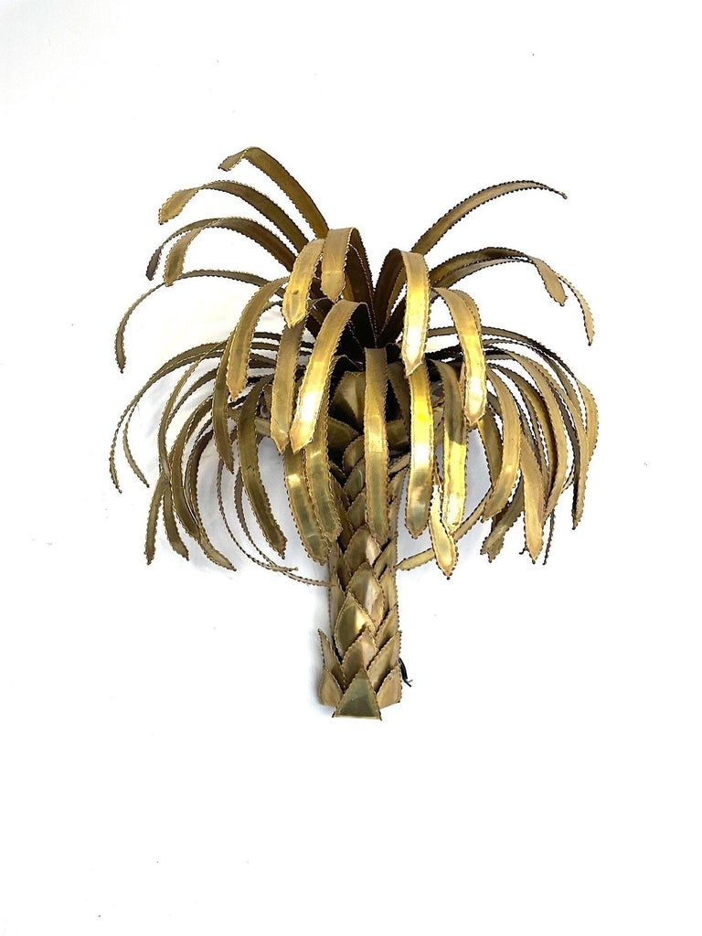 A 1970s Maison Jansen torch cut brass palm tree wall light at 1stDibs