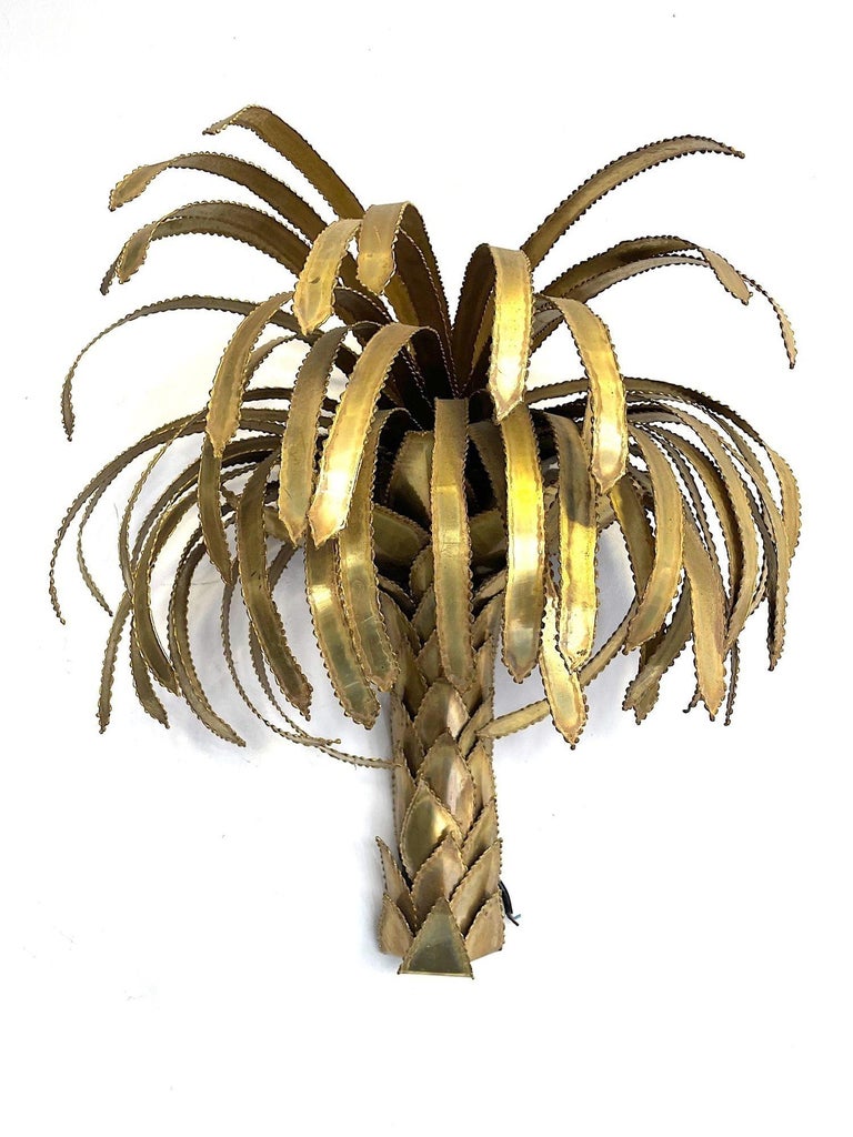 A 1970s Maison Jansen torch cut brass palm tree wall light at 1stDibs